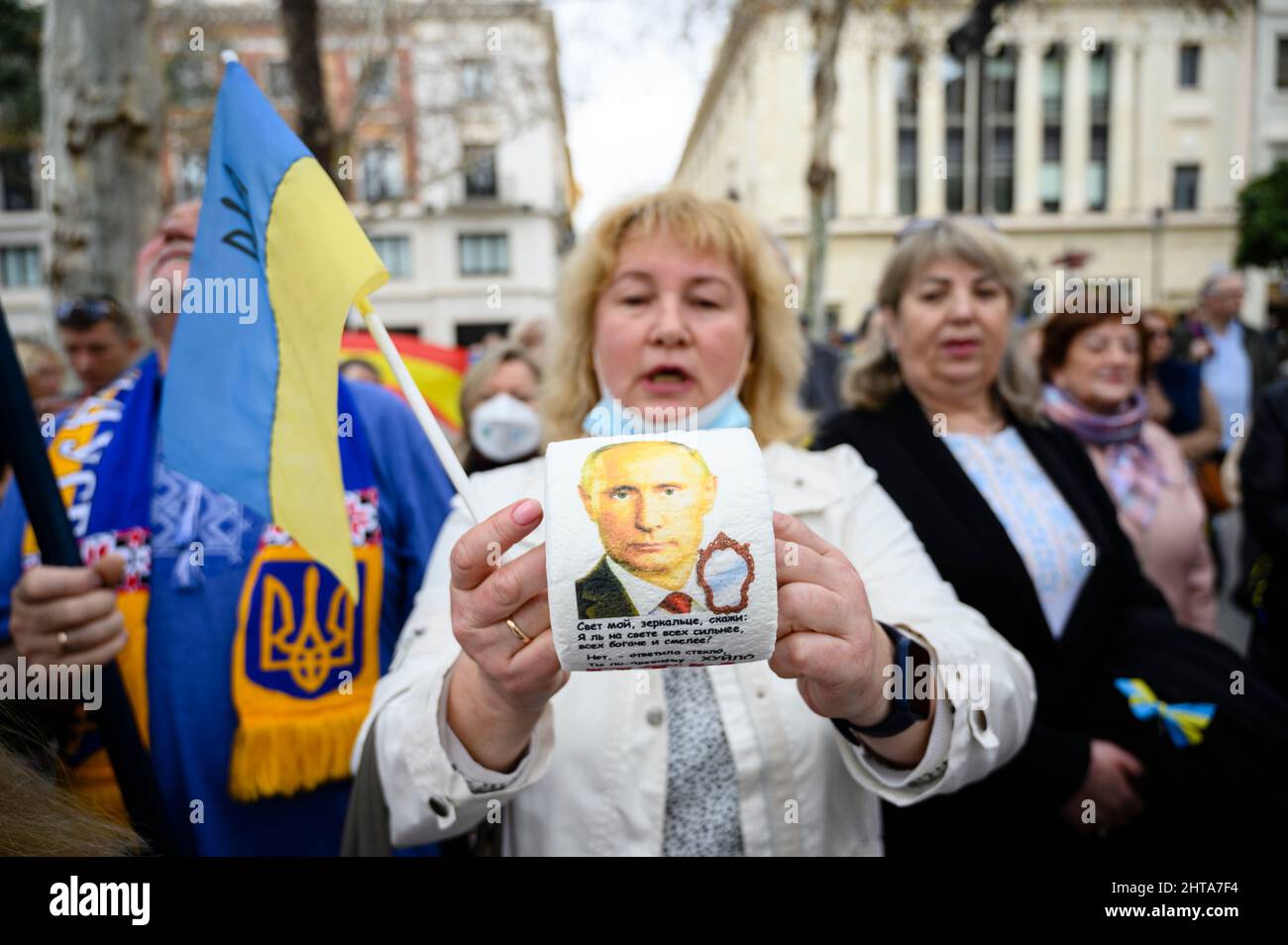 A Ukrainian woman shows a toilet paper roll with the face of Russian ...