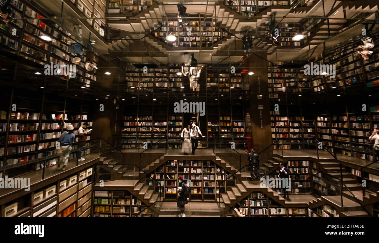 Beautiful book shop interior with mirror ceiling and staircases Stock ...
