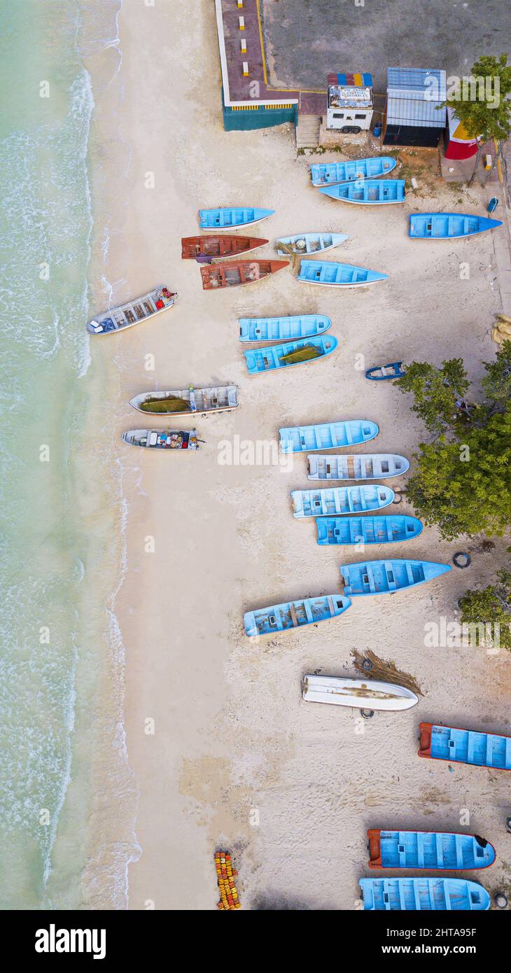 Aerial shot of blue boats moored on the sandy shore Stock Photo - Alamy