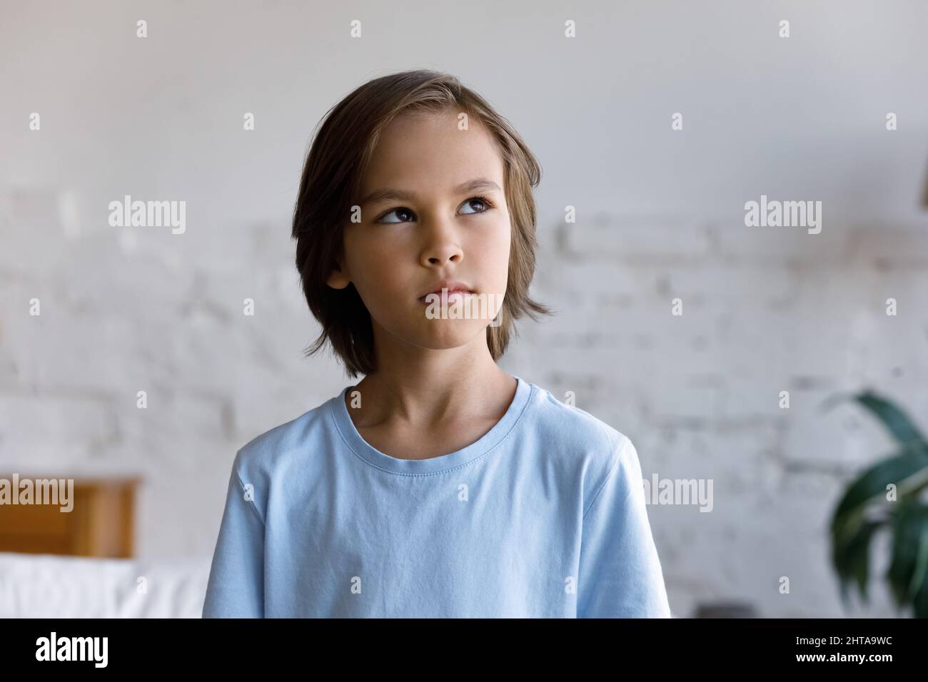 Headshot portrait pensive little boy staring aside looking thoughtful ...
