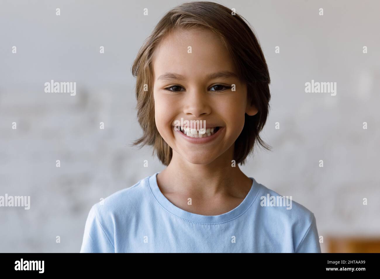 Headshot portrait 9s boy smile look at camera Stock Photo - Alamy