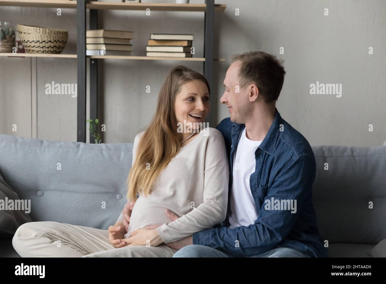 Young happy couple parent hi-res stock photography and images - Alamy