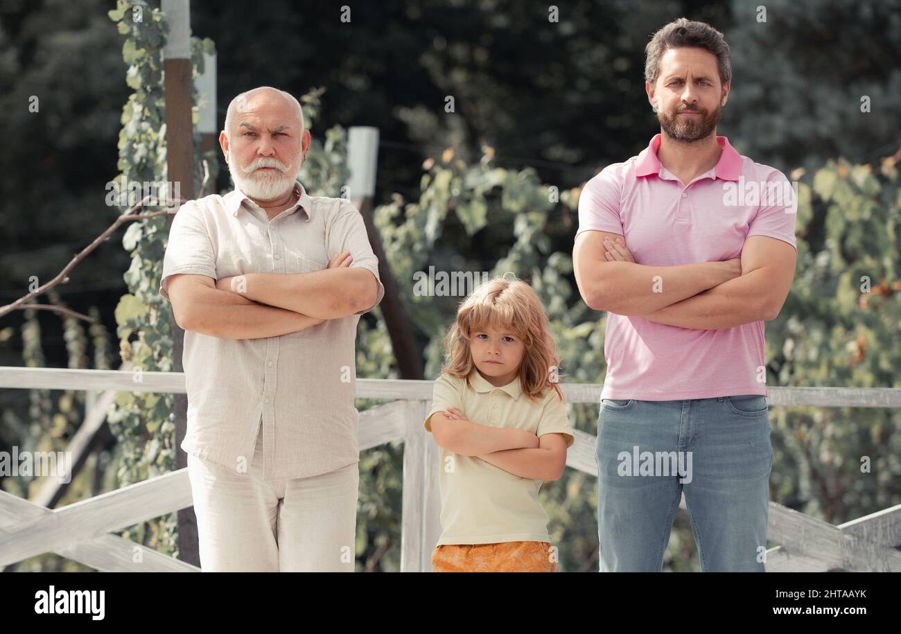 Men generation grandfather father and son are in garden. Fathers day ...