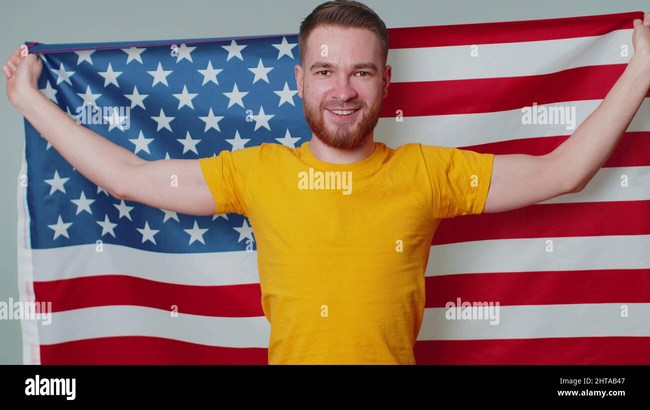Man waving, wrapping in American USA flag, celebrating, human rights ...