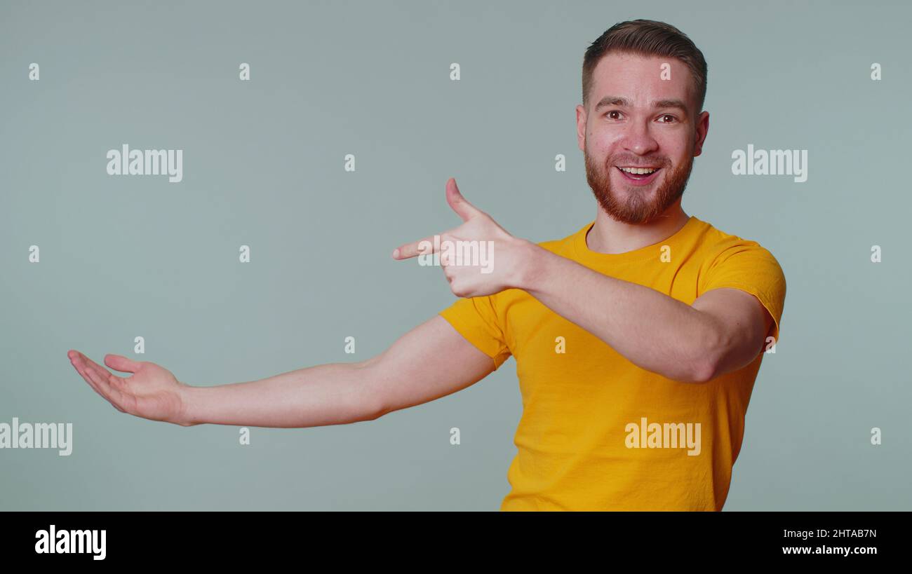 Man pointing empty place, advertising area for commercial text, copy ...