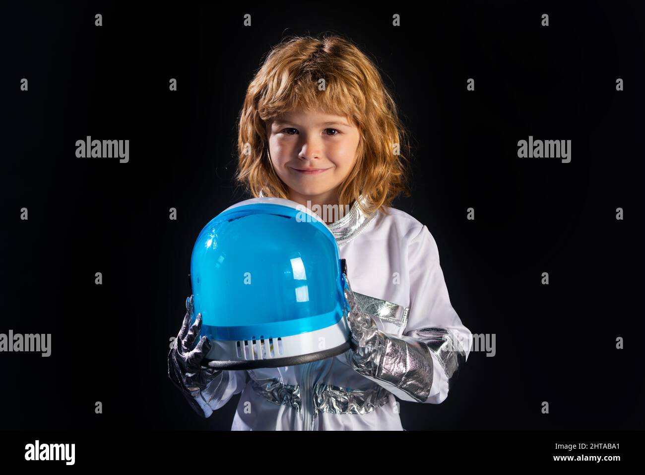 Kid boy exploring space. Portrait of cute kids in space suits ...