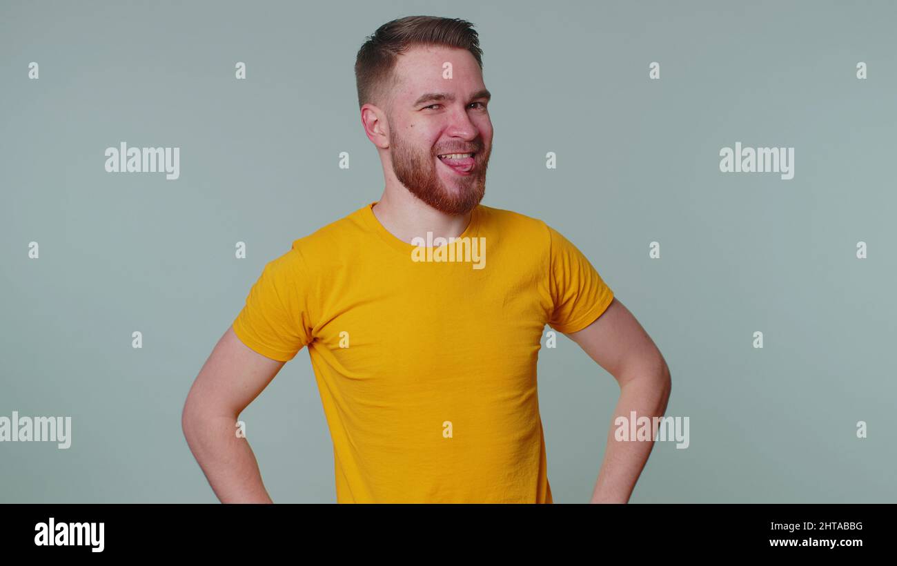 Funny showing tongue making faces at camera, fooling around, joking ...