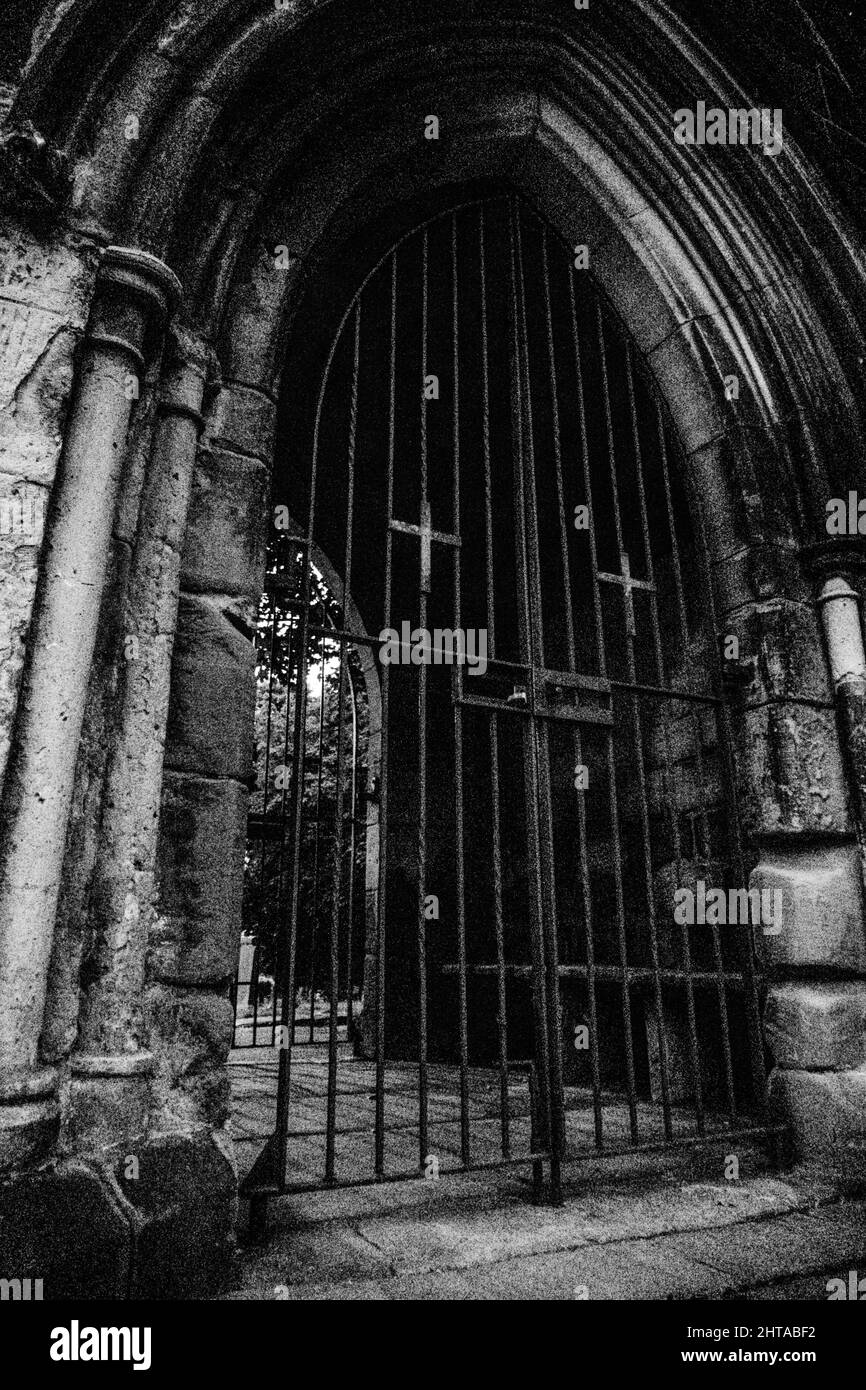 Grayscale of an iron gate of the church Stock Photo - Alamy