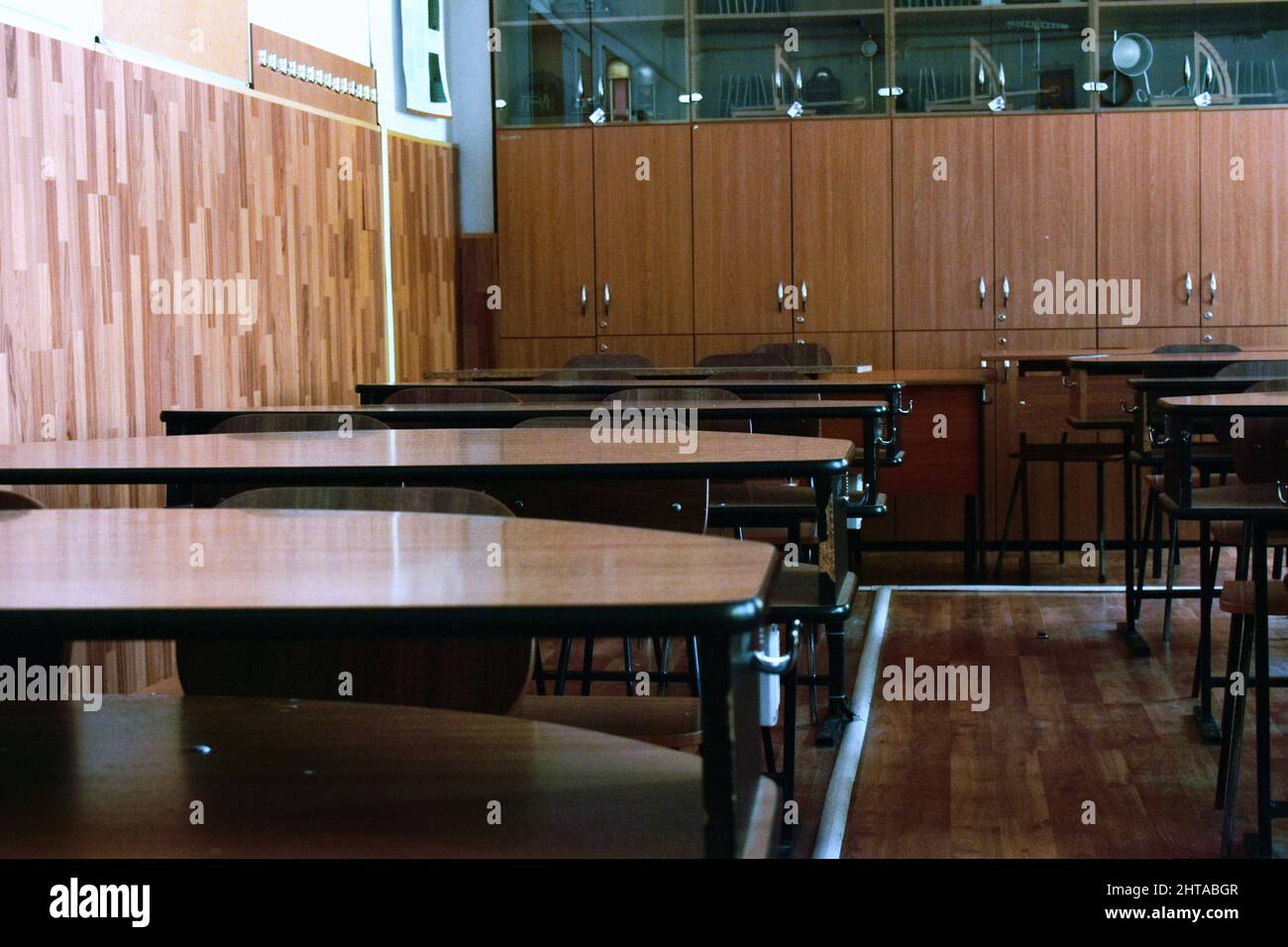 Small empty classroom with brown wooden furniture Stock Photo - Alamy