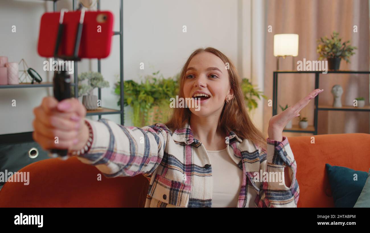 Girl blogger influencer taking selfie on smartphone, make virtual ...