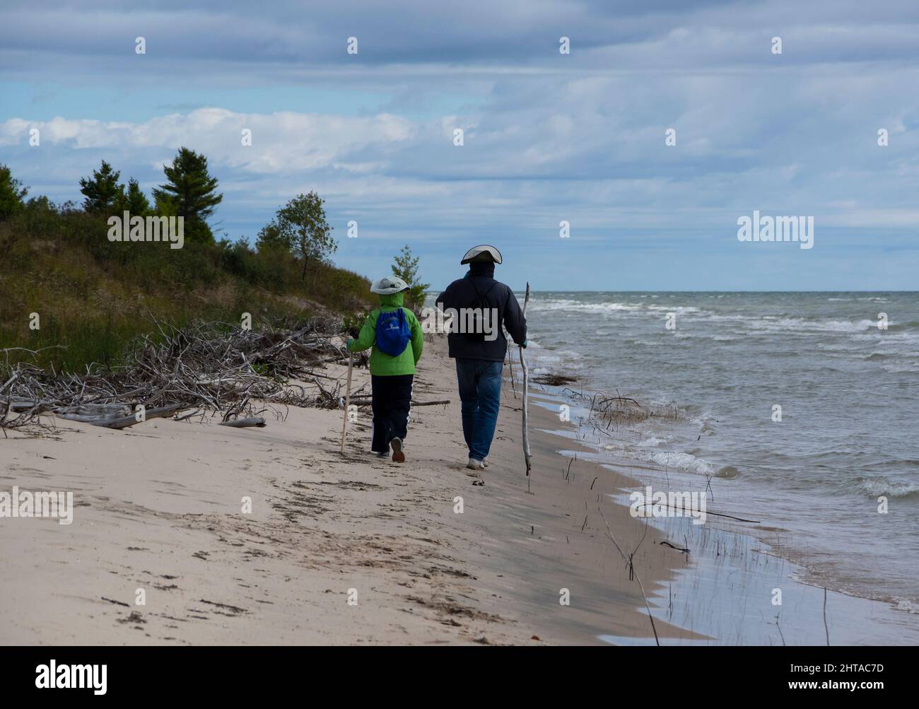 Couple walking on Lake Michigan beach at Point Beach State Forest near ...