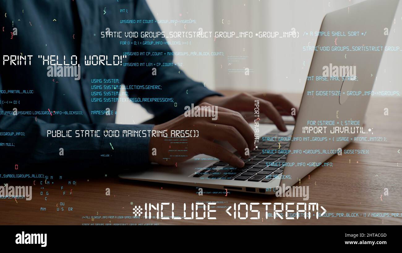 Computer Programmer Uses Capable Laptop Computer To Develop Programming Code Of New Software