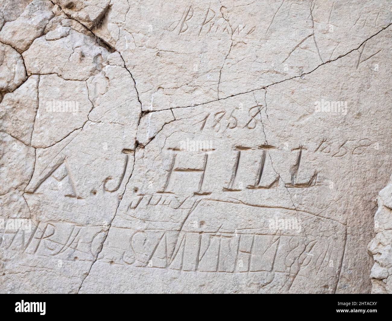 A. J. Hill name carved into the soft rock at Register Cliff around 1858 ...