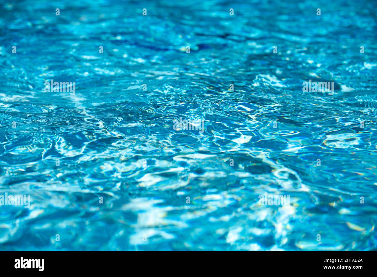 Water in swimming pool, background with high resolution. Wave abstract or rippled water texture ...