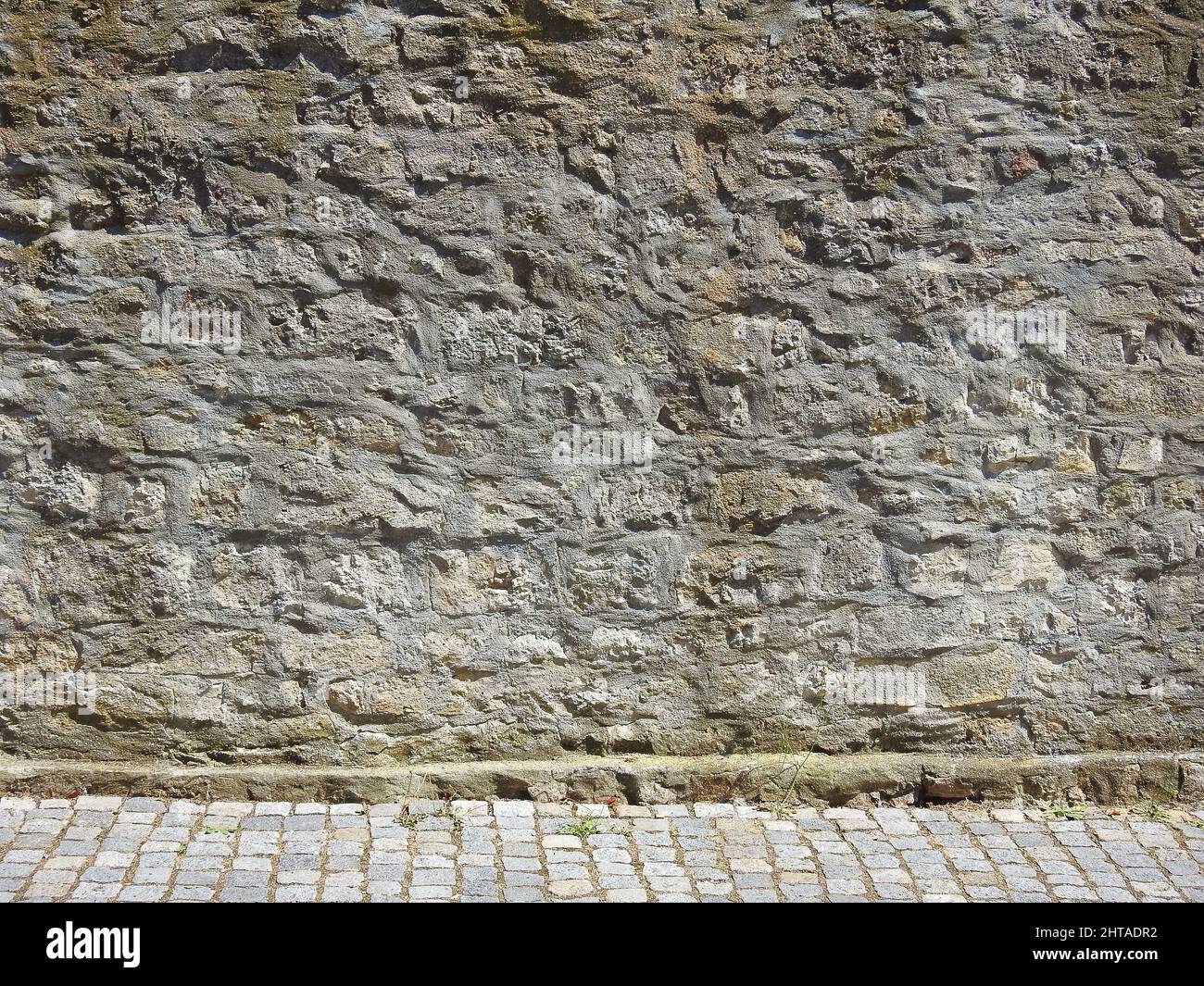 Front view of a stone wall texture Stock Photo - Alamy
