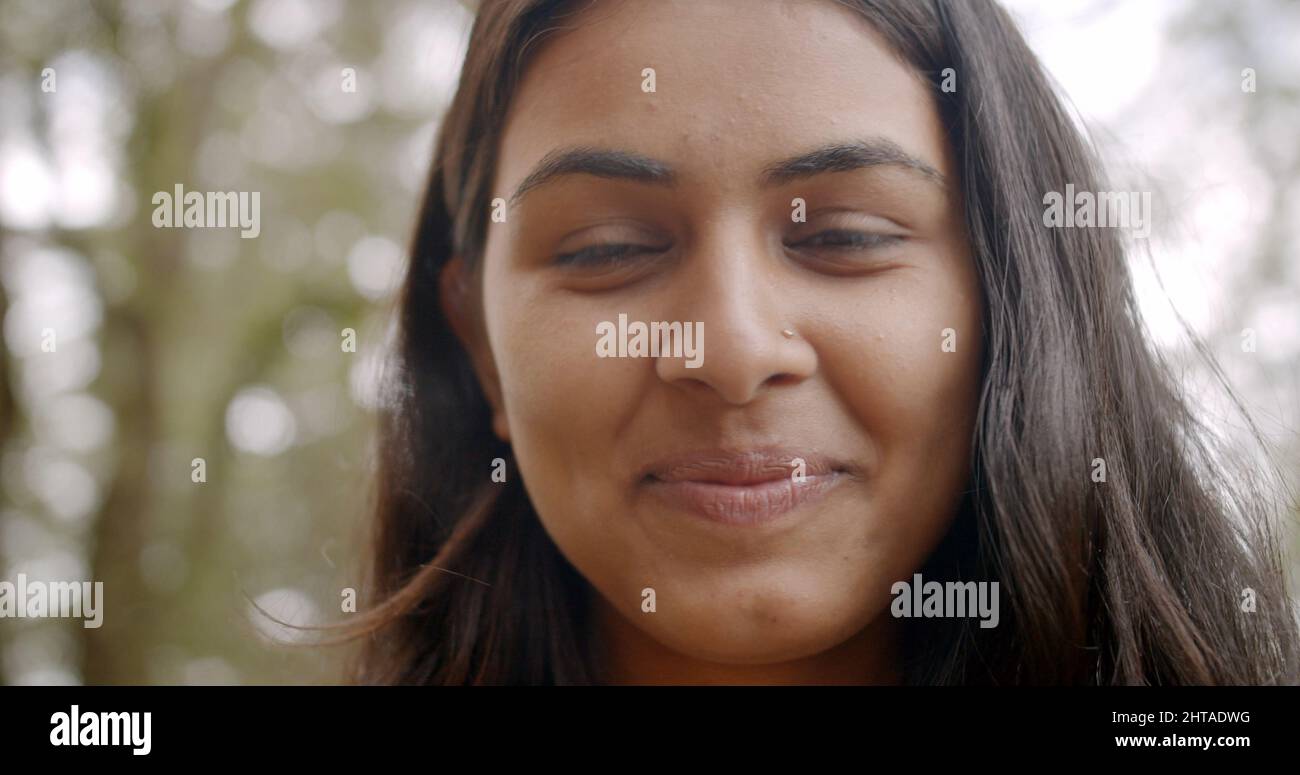 Lovely Indian girl smiling in the park Stock Photo - Alamy