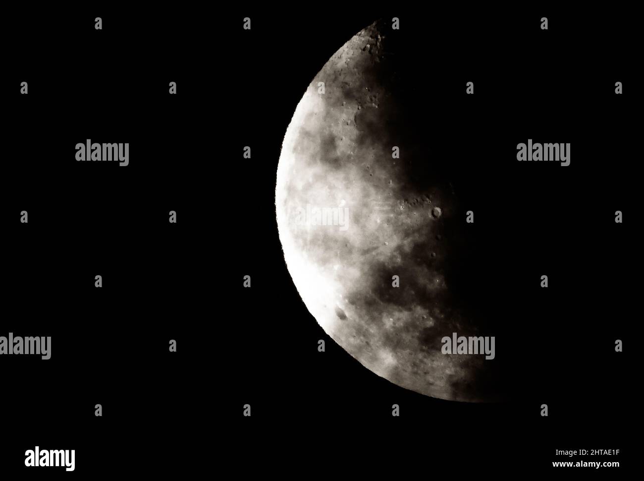 Zoomed in shot of the half moon on the dark sky Stock Photo - Alamy