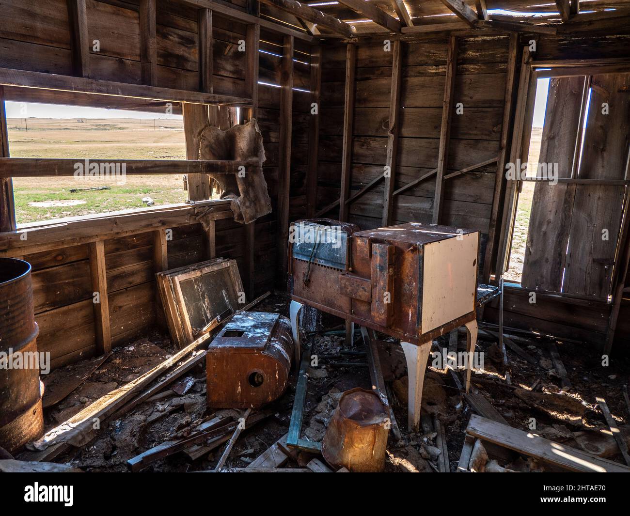 Old deserted wooden home full of discarded appliances and junk Stock ...