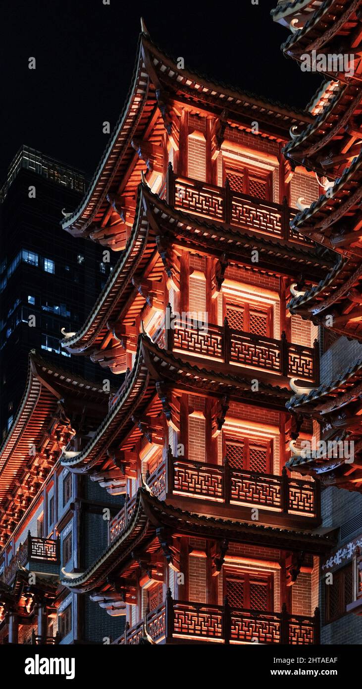 Illuminated Chinese architectural building at night Stock Photo - Alamy