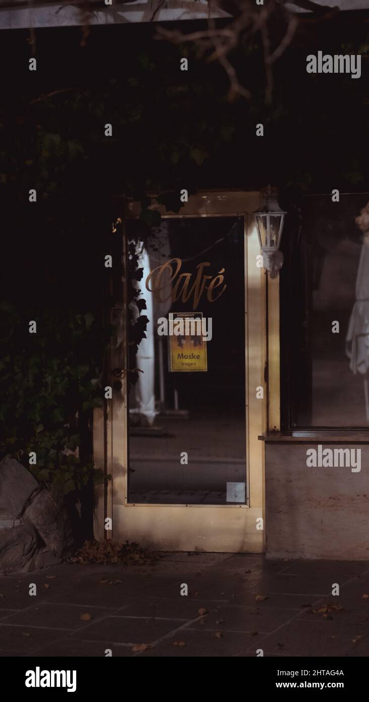 Shot of an Old door with a sign of cafe Stock Photo - Alamy