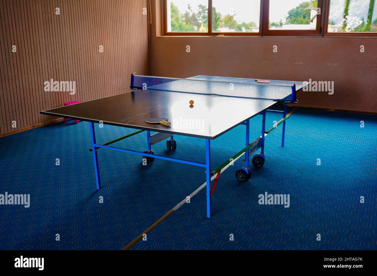 Shot of the Tennis table game and the balls and rackets on it Stock ...