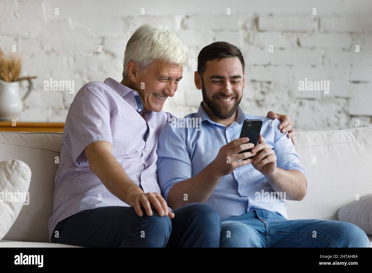 Senior old man watching smartphone hi-res stock photography and images ...