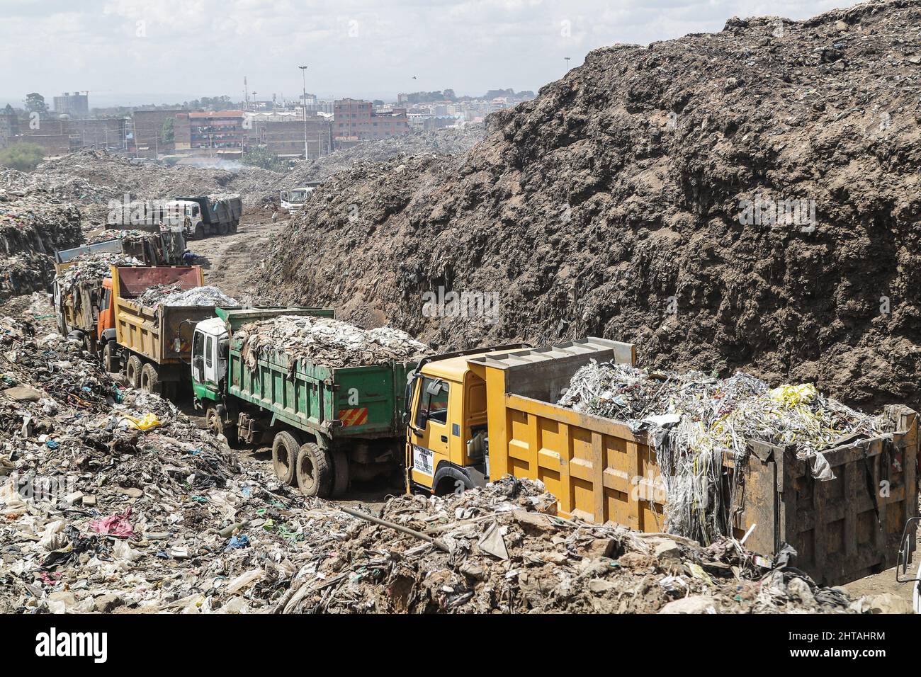 Trucks line up to unload garbage at Dandora Dumping site, everyday an ...