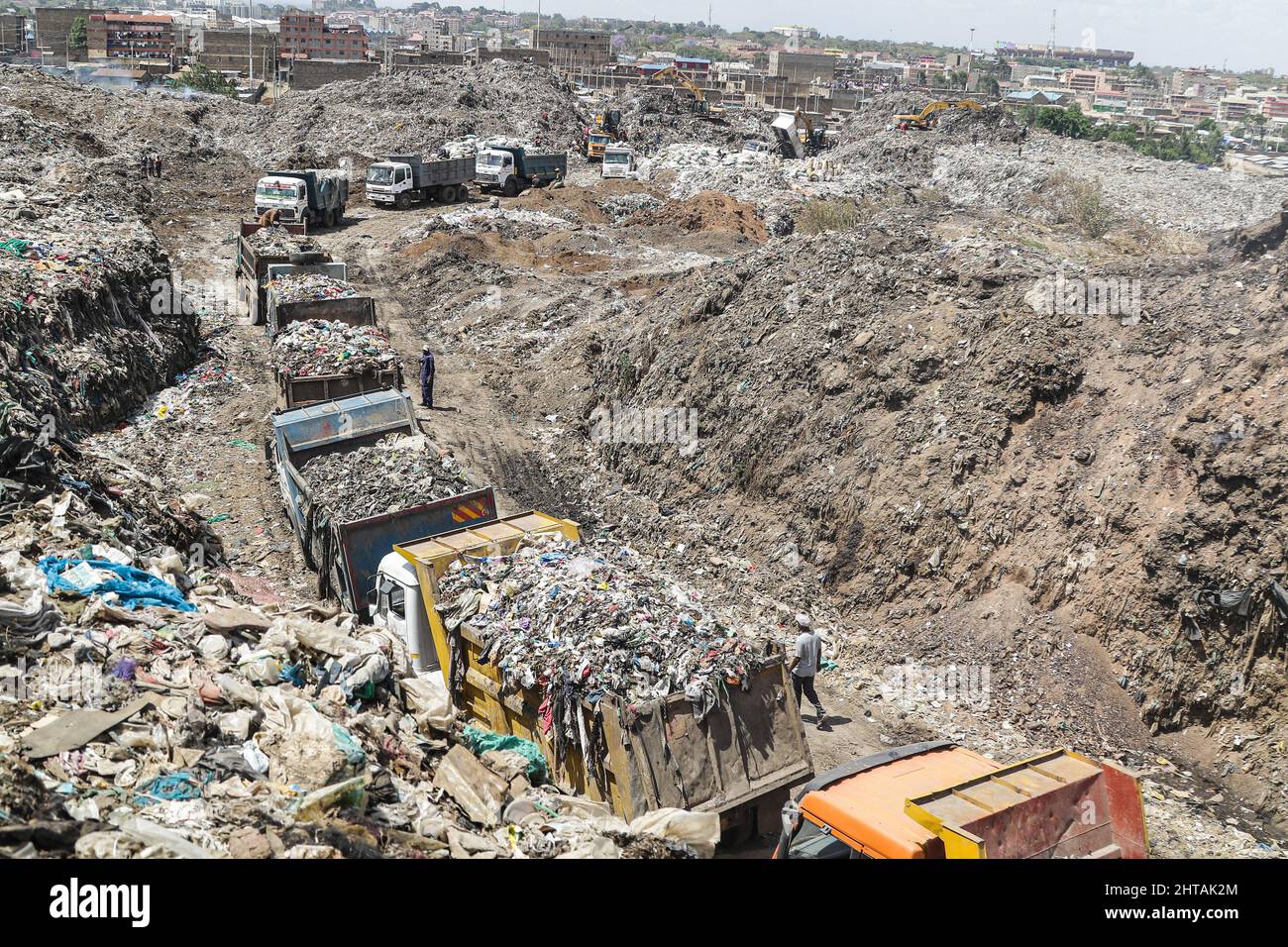 Trucks line up to unload garbage at Dandora Dumping site, everyday an ...