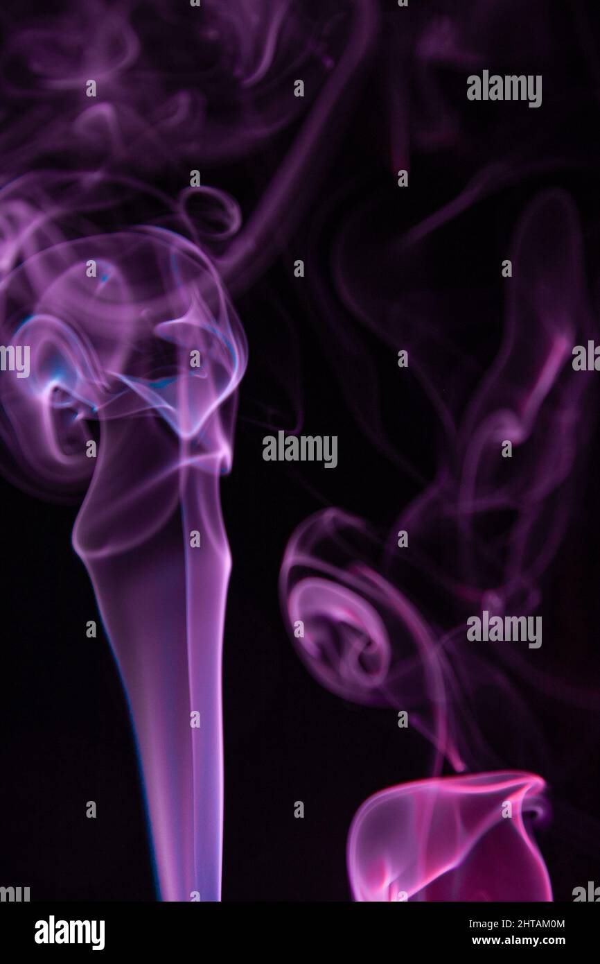 A vertical wallpaper with smoke on black background Stock Photo - Alamy
