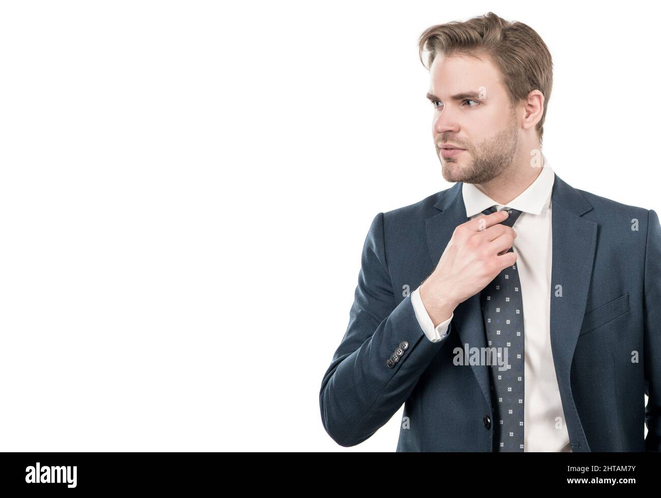 Serious businessman man adjust necktie in formal suit isolated on white ...