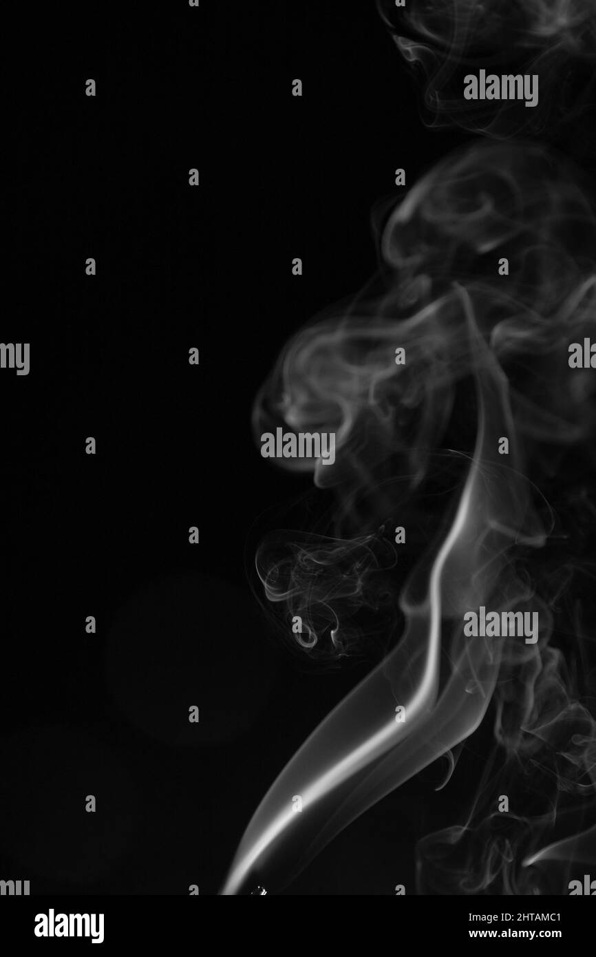 Vertical grayscale shot of a smoke on a black background Stock Photo ...