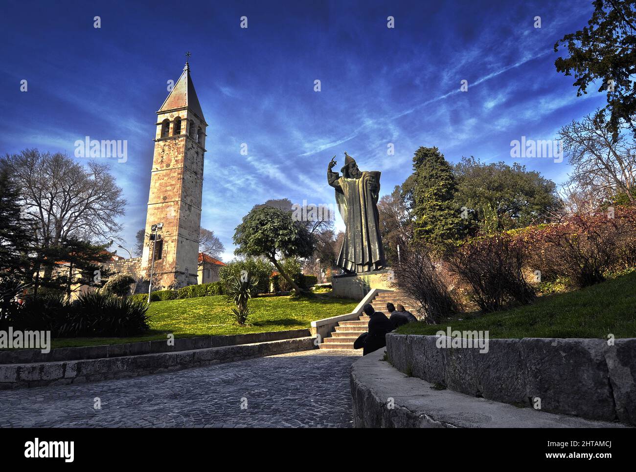 Bright summer day at the bell tower and the Chapel of the Holy Arnir in ...