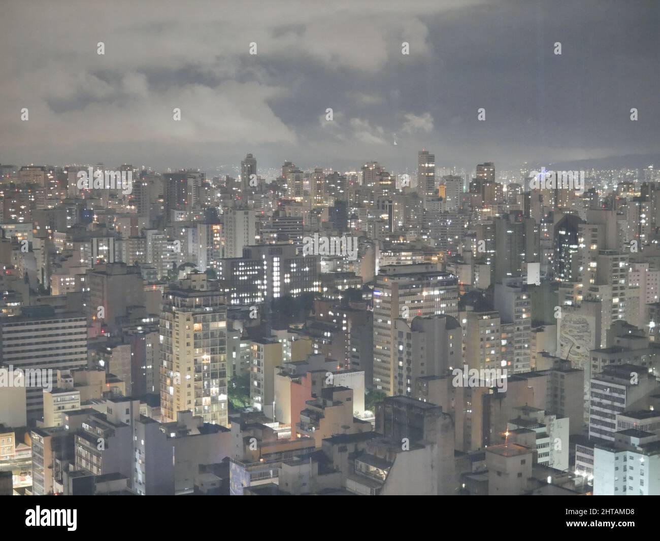 Bird's eye view of the dense buildings illuminating the cityscape of ...