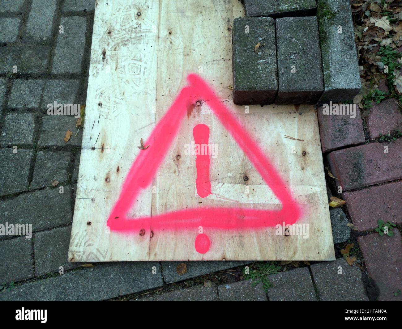 Warning sign on the ground Stock Photo - Alamy