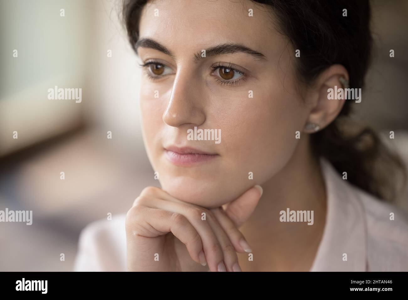 Dreamy millennial Hispanic woman looking in distance Stock Photo - Alamy