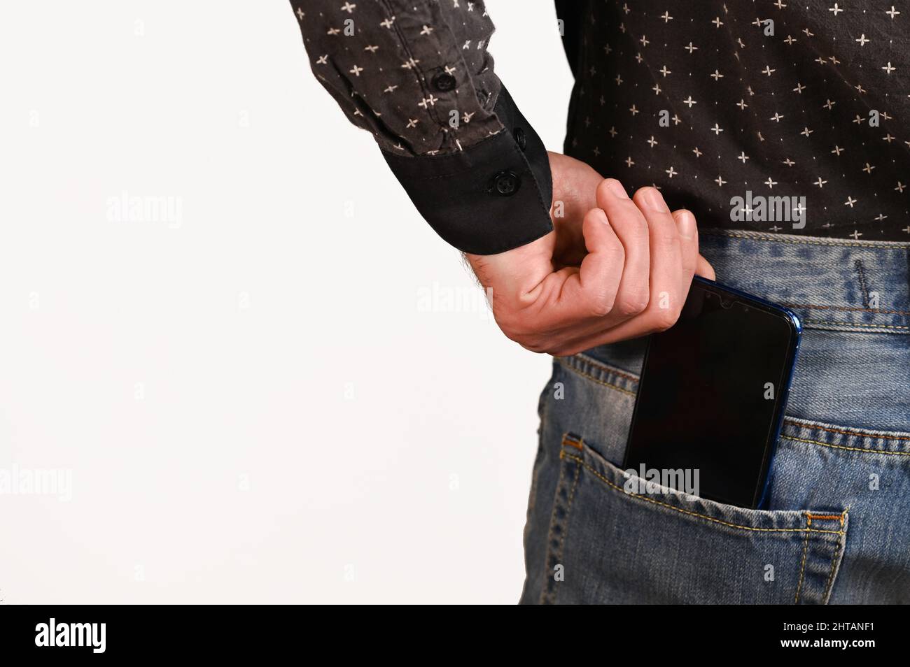 take your phone out of the back pocket of your trousers. isolated Stock ...