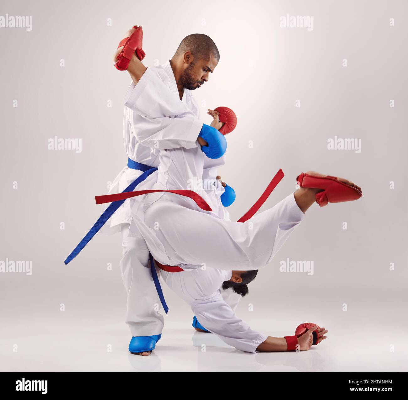 Hes got her beat. Two peopledoing karate Stock Photo - Alamy