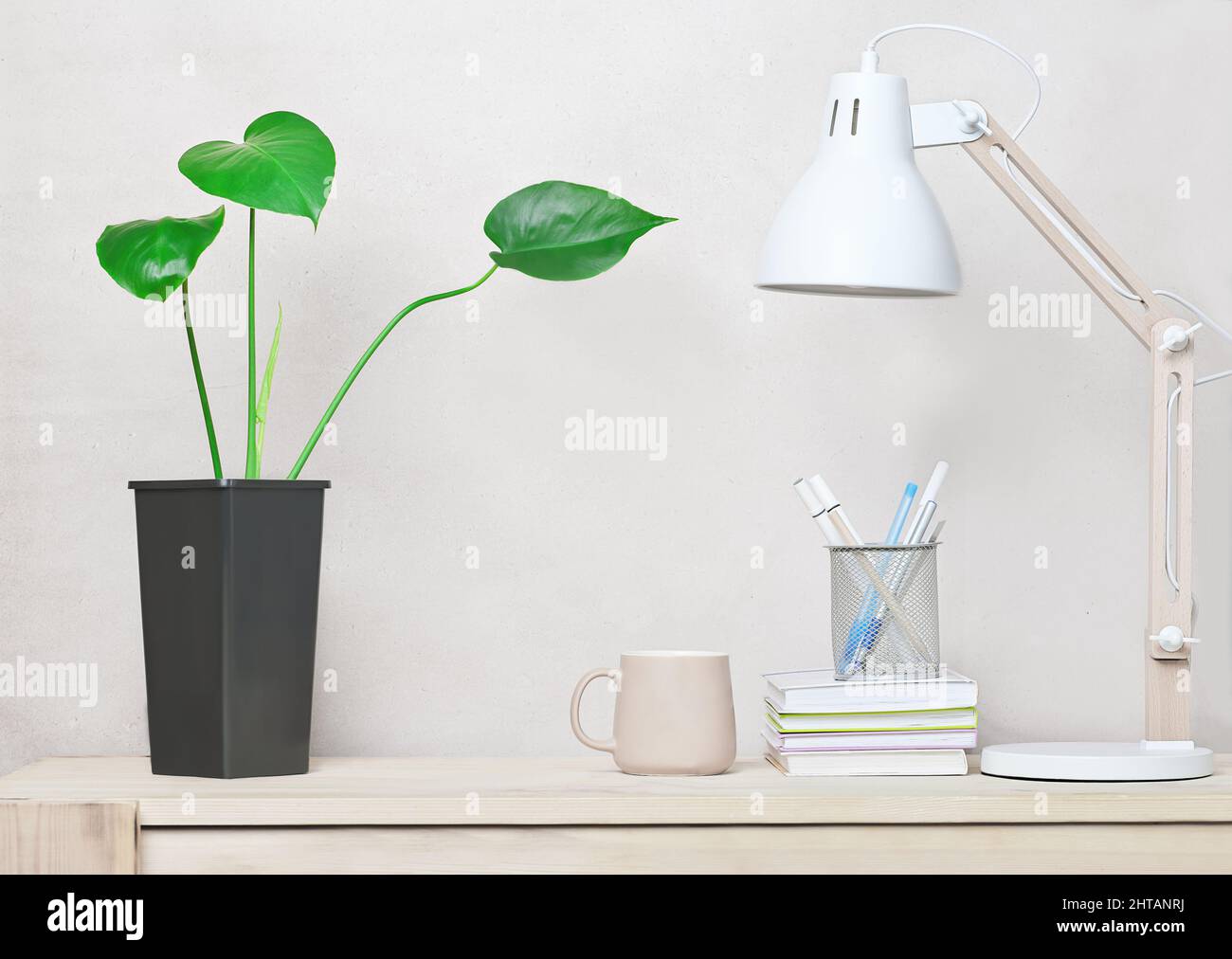 learning and study concept. desk lamp and books and pens on a table ...