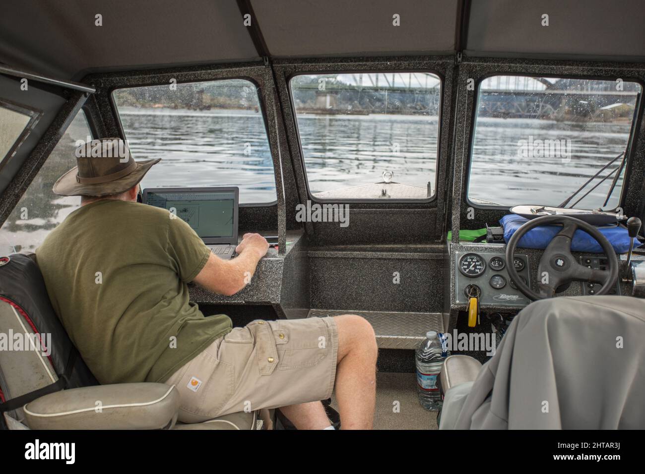 Working in the Front, Fishing in the Back Stock Photo - Alamy