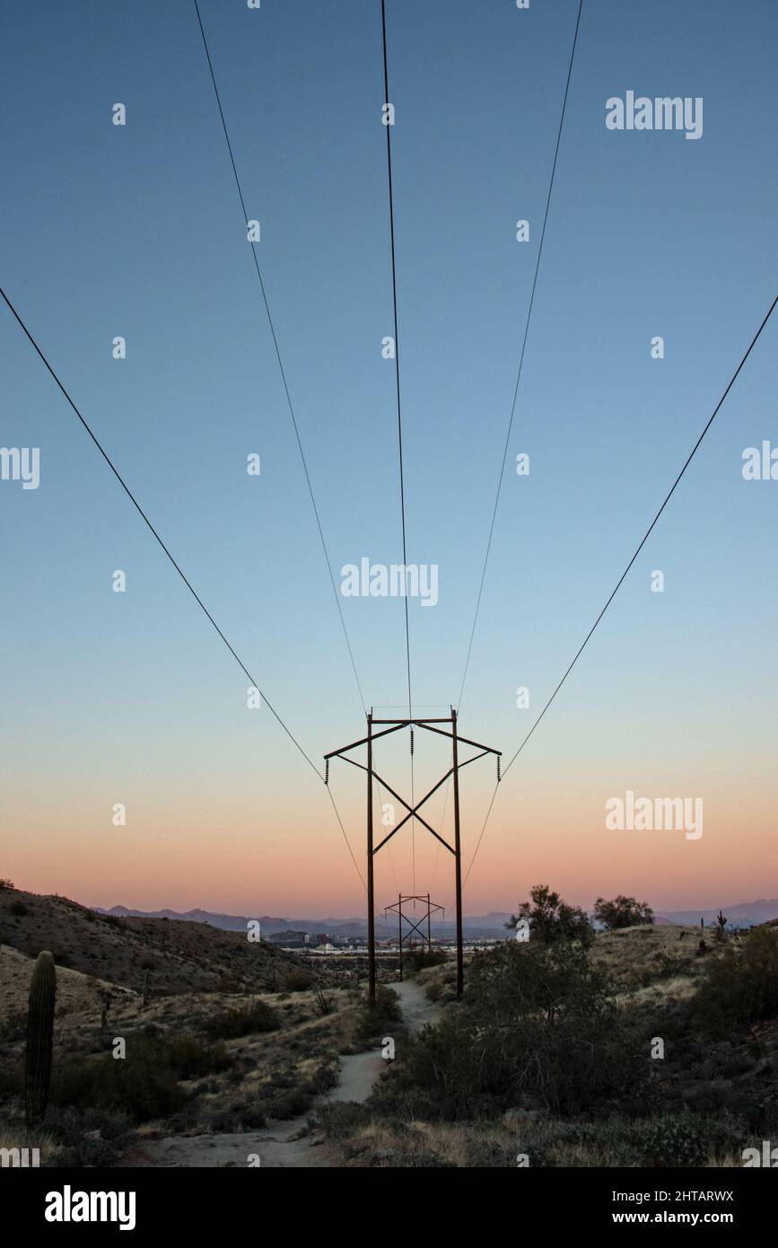 Power lines over a desert trail Stock Photo - Alamy