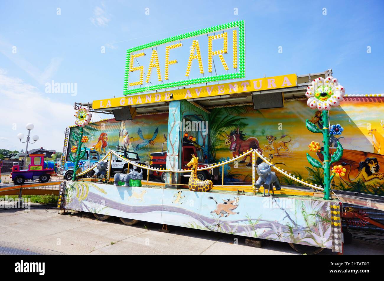 Safari animal carousel attraction at a fair Stock Photo - Alamy