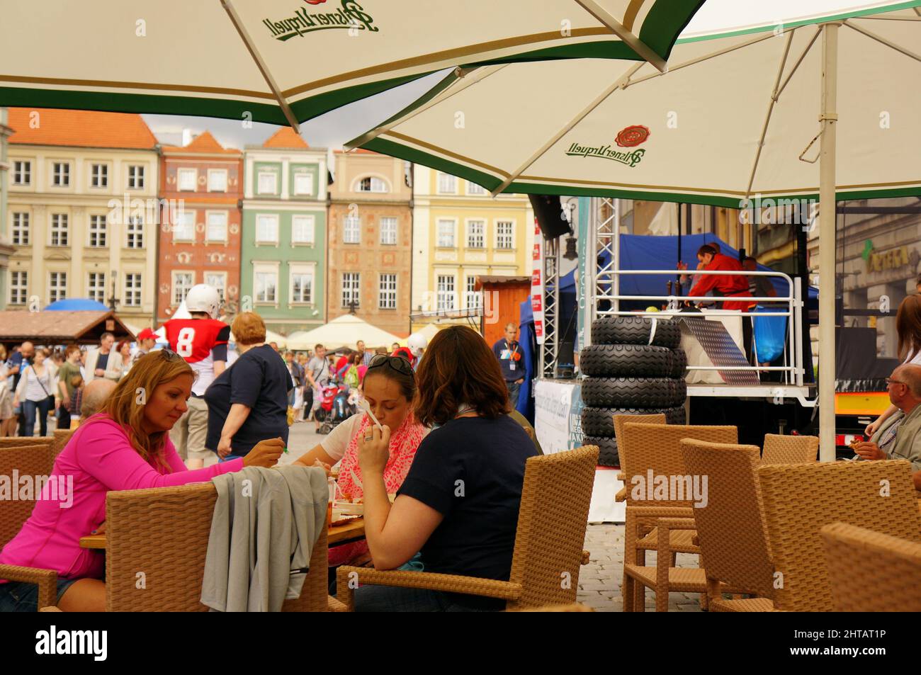 People eating and drinking at a restaurant in the old city square Stock ...