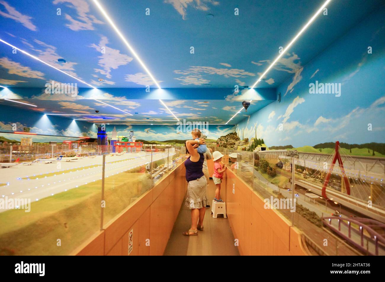 Walkway between a model world with trains at a miniature exposition ...