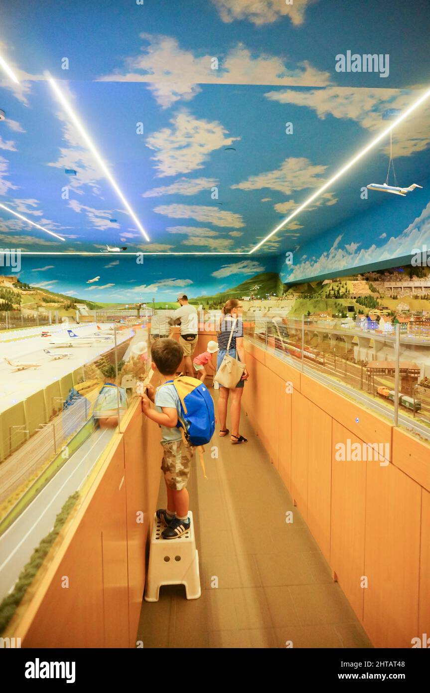 Walkway between a model world with trains at a miniature exposition ...