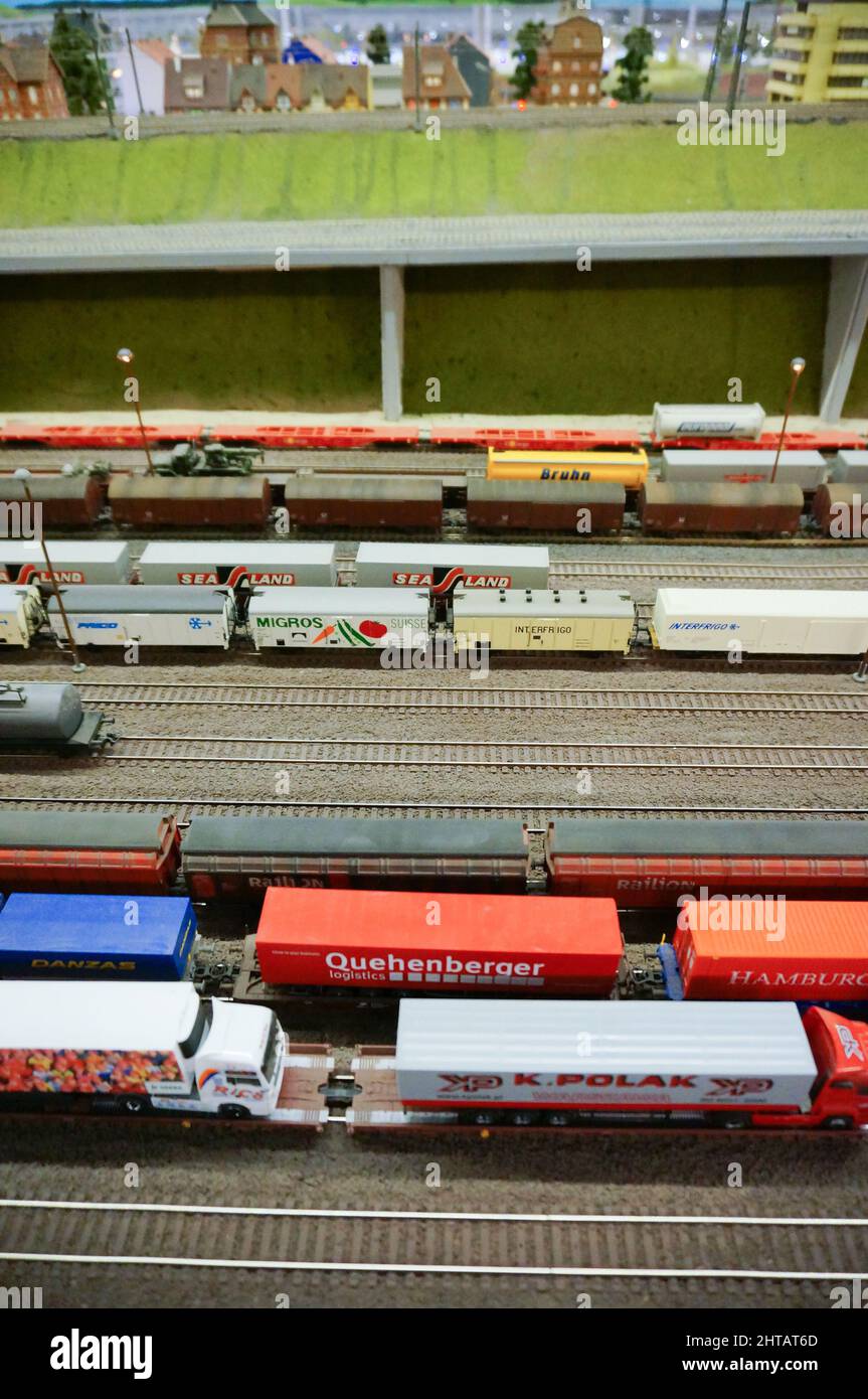 Transport trucks and train wagons at an indoor miniature exposition ...