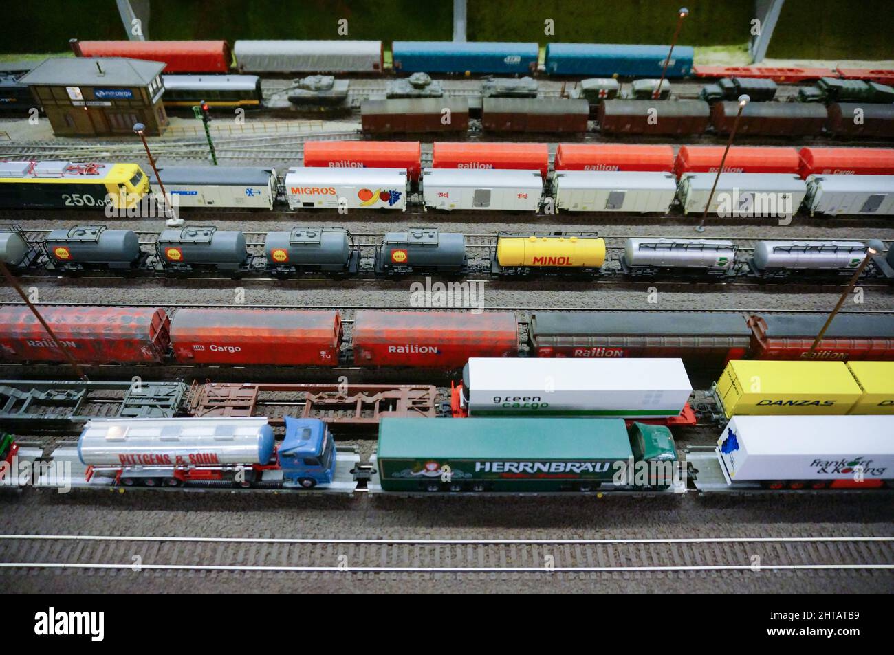 Transport trucks and train wagons at an indoor miniature exposition ...