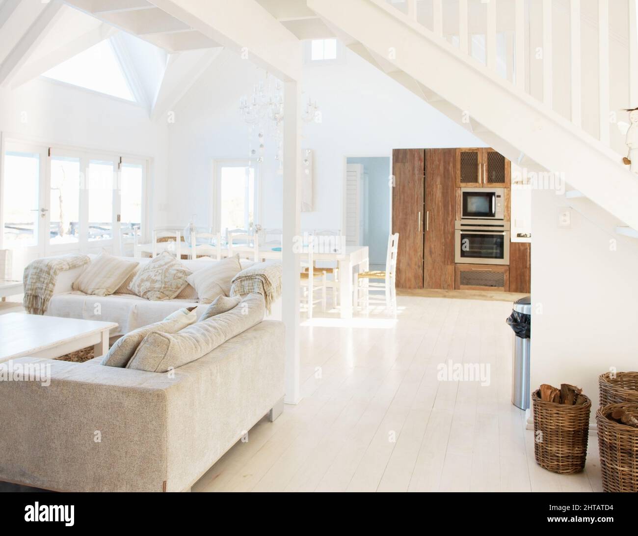 Shining a light on modern living. Spacious modern white interior of a ...