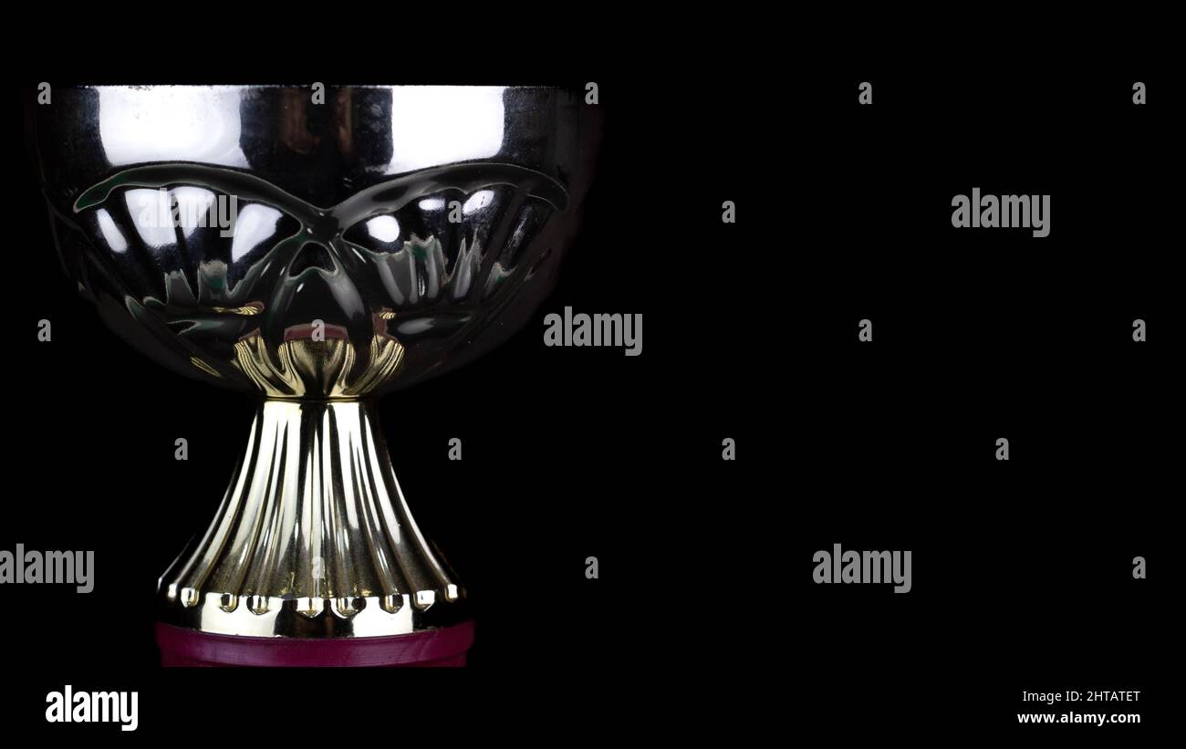Shiny cool silver trophy isolated on a black background Stock Photo - Alamy