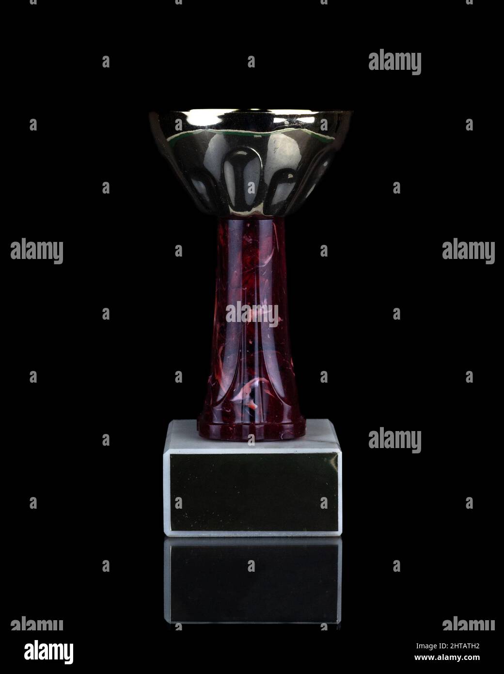 Silver red trophy isolated on a black background Stock Photo - Alamy