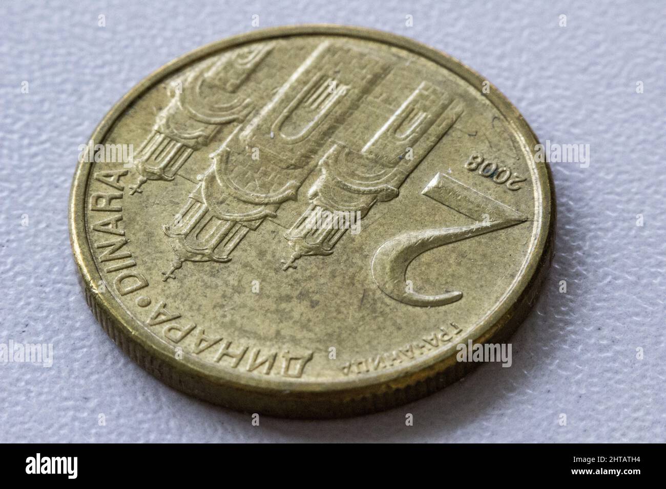 Closeup of 2 Dinar coin on a white background Stock Photo - Alamy